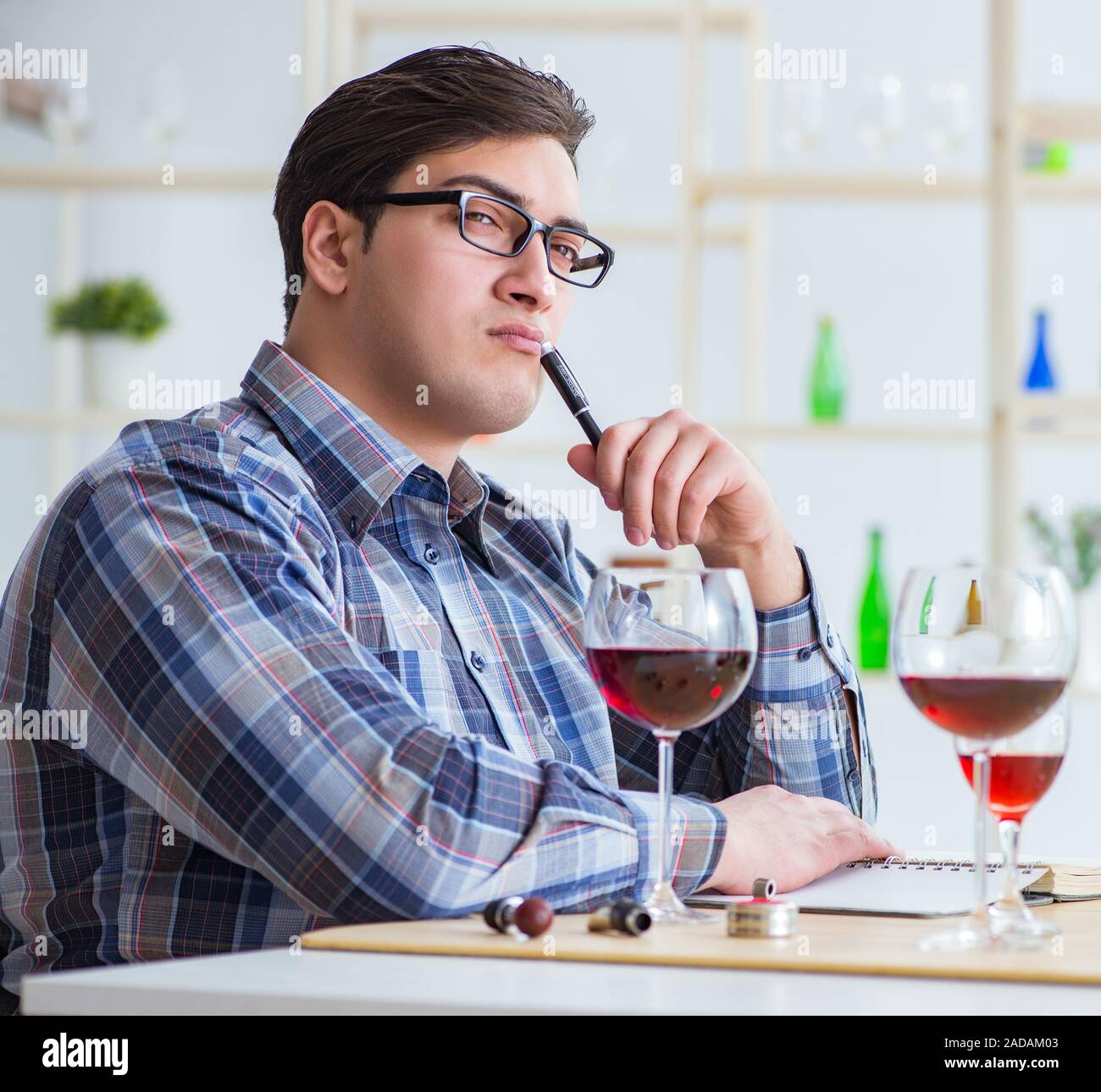 Professional sommelier tasting red wine Stock Photo - Alamy