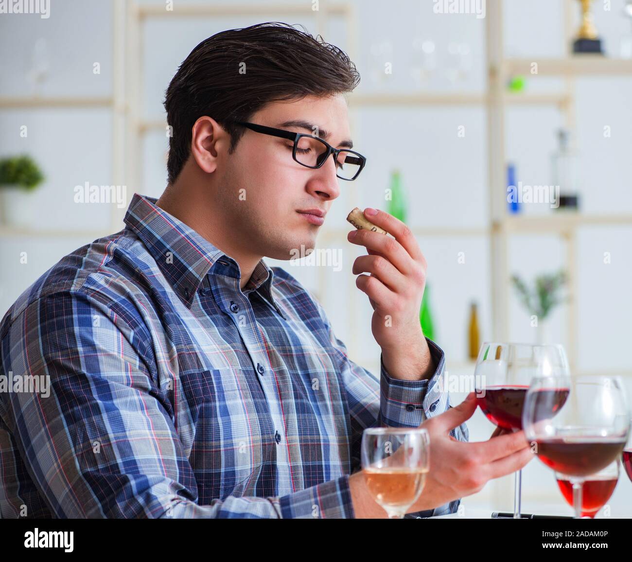 Professional sommelier tasting red wine Stock Photo - Alamy
