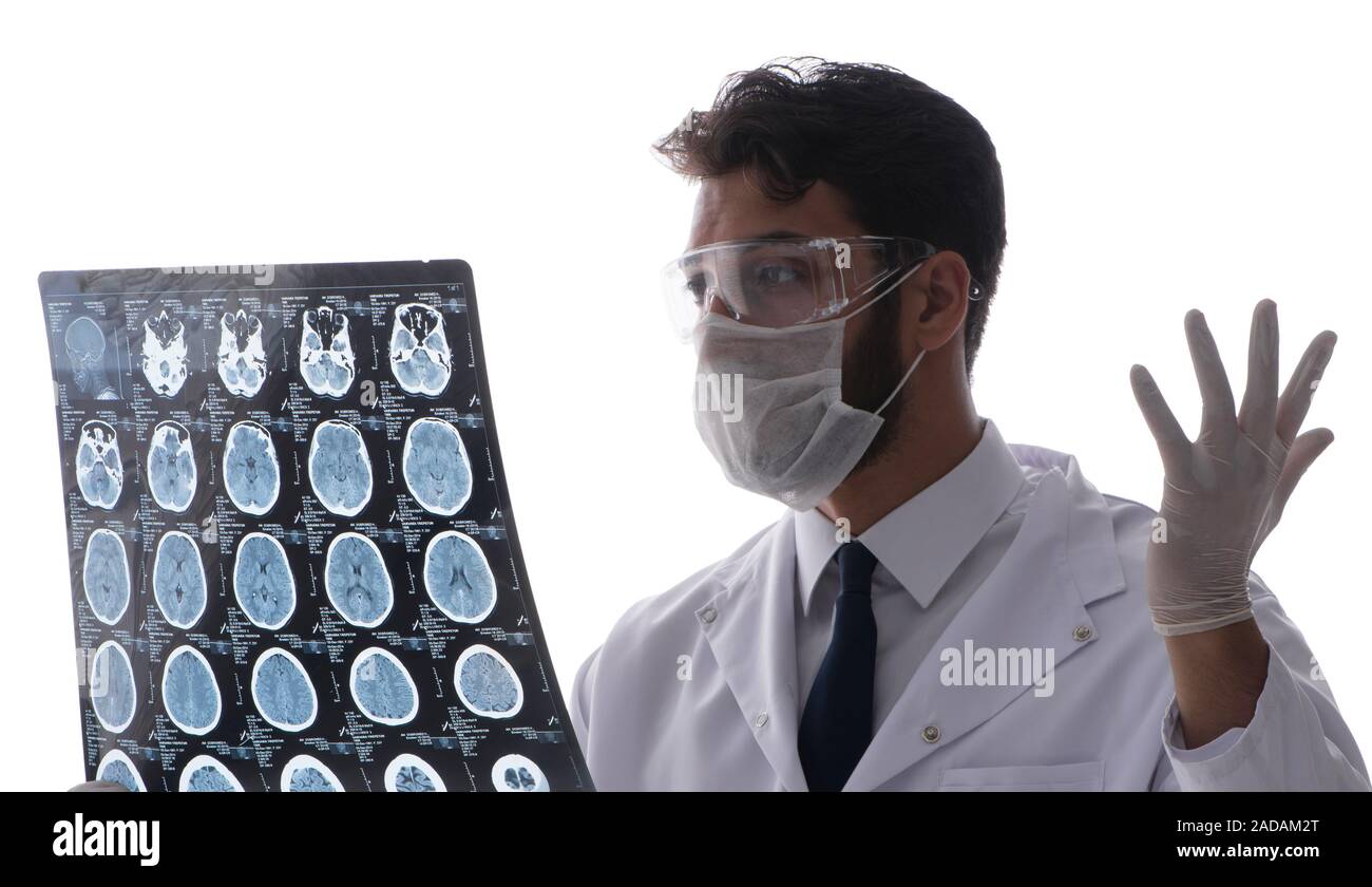 Young doctor looking at x ray images isolated on w hi-res stock ...