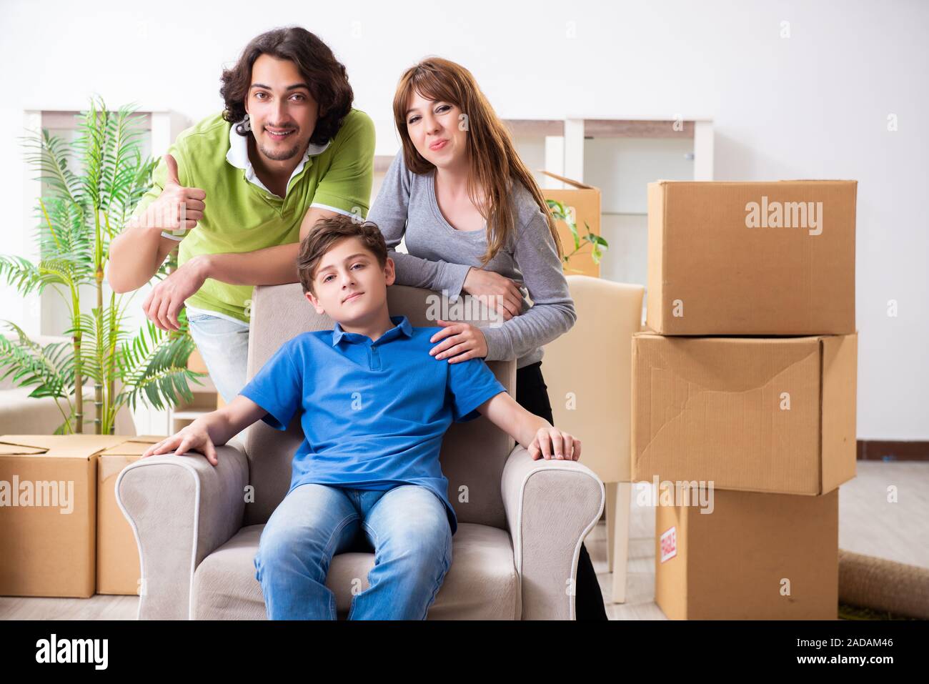 Young family moving to new flat Stock Photo - Alamy