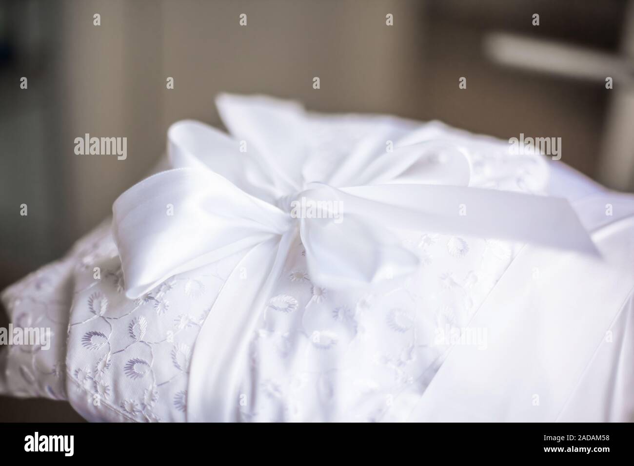 close up.beautiful white knotted ribbon on a baby blanket Stock Photo ...