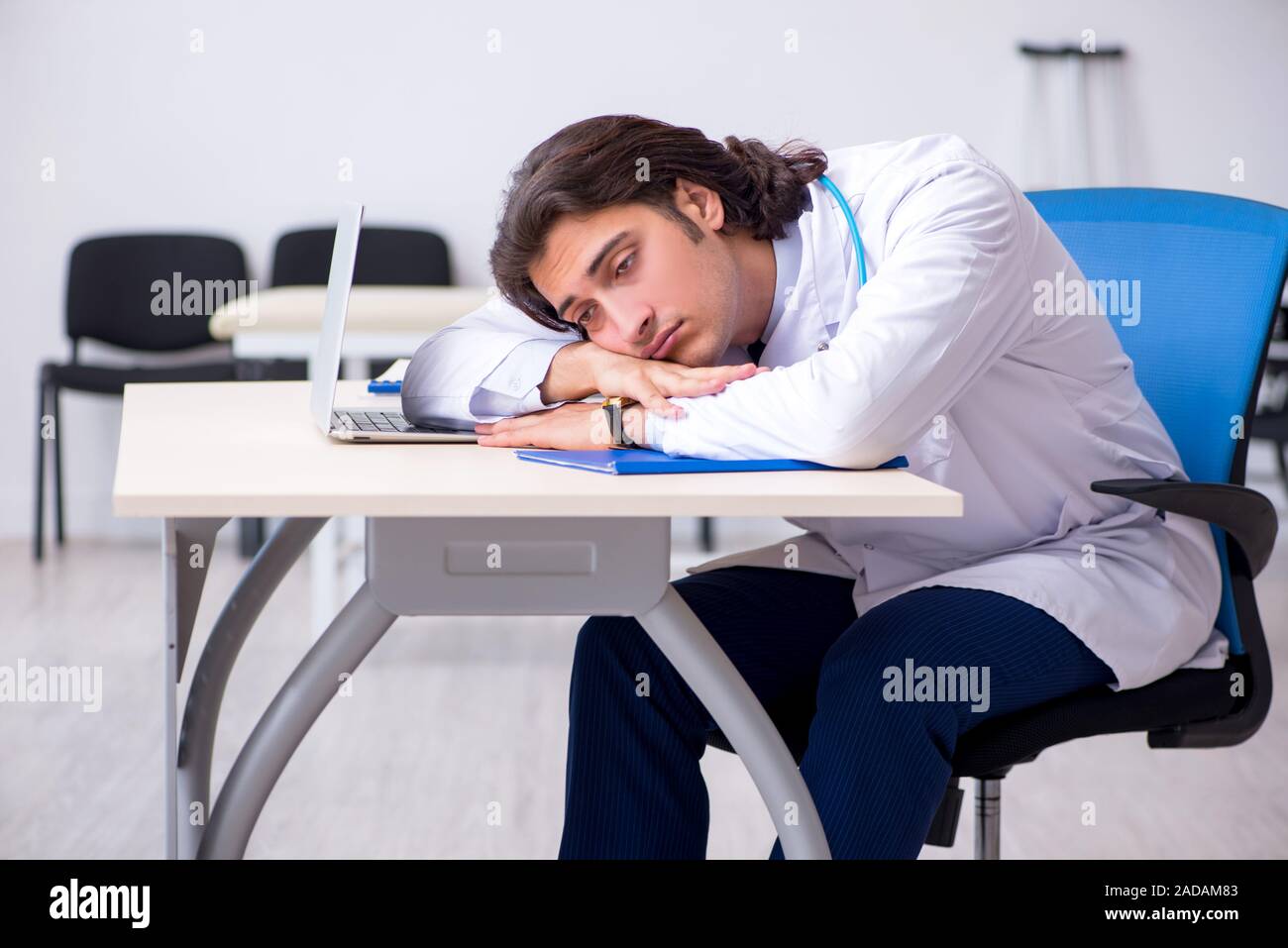 Young doctor being tired after night shift Stock Photo - Alamy