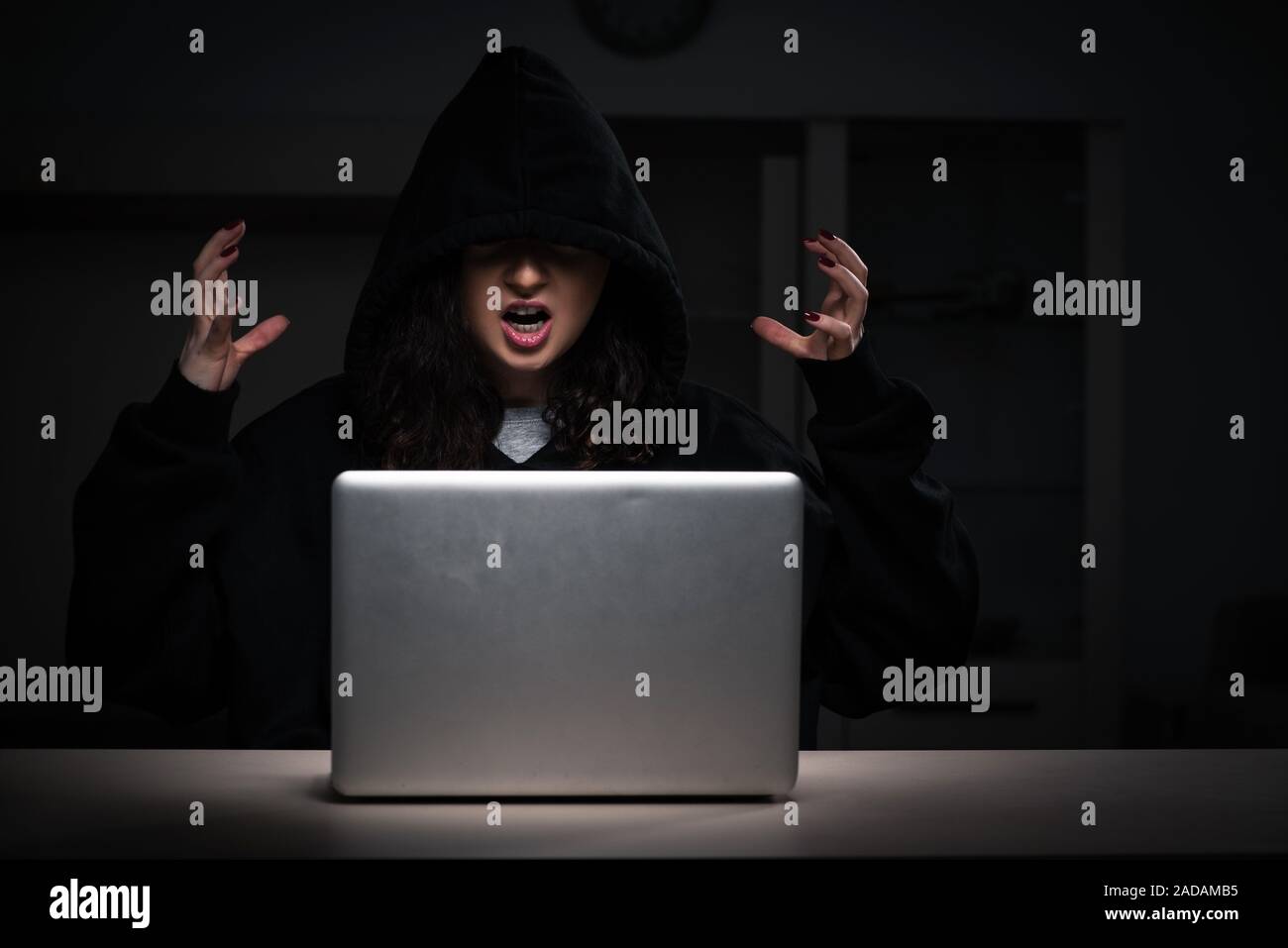 Female hacker hacking security firewall late in office Stock Photo - Alamy