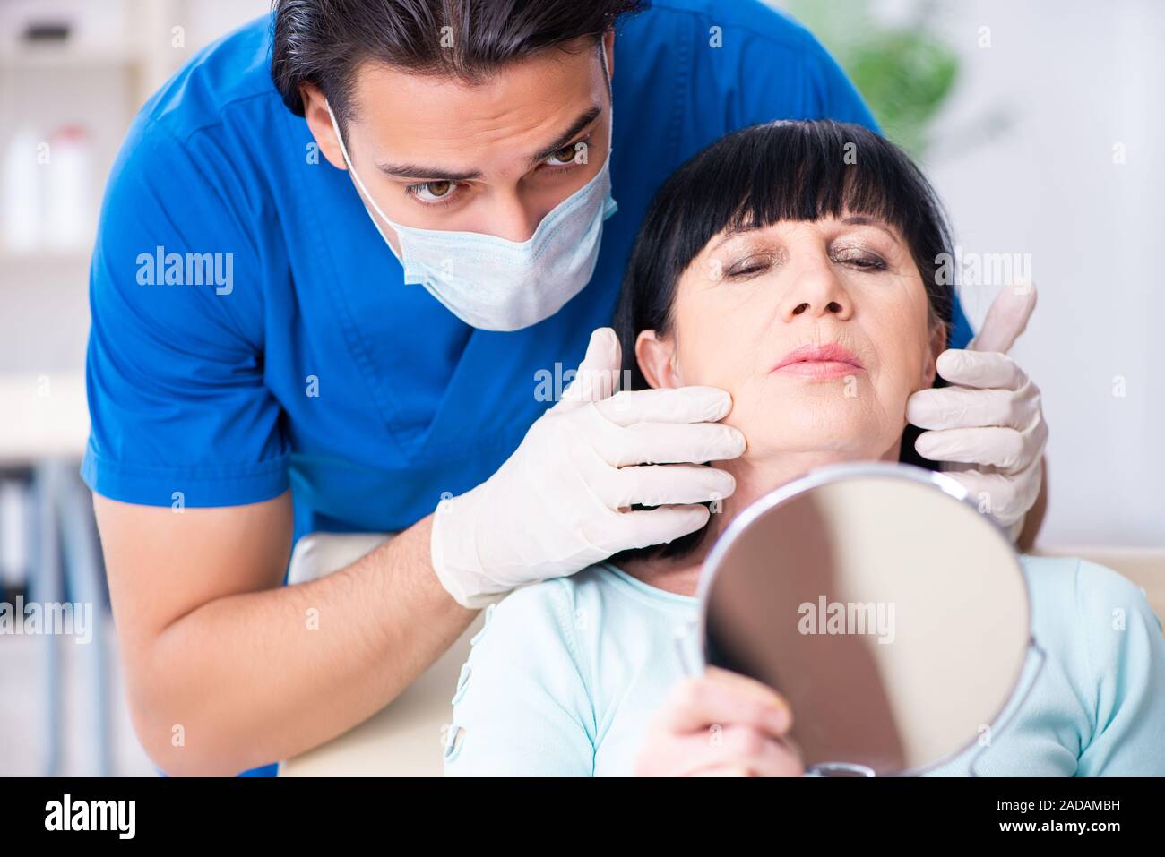 Old woman visiting male doctor for plastic surgery Stock Photo - Alamy