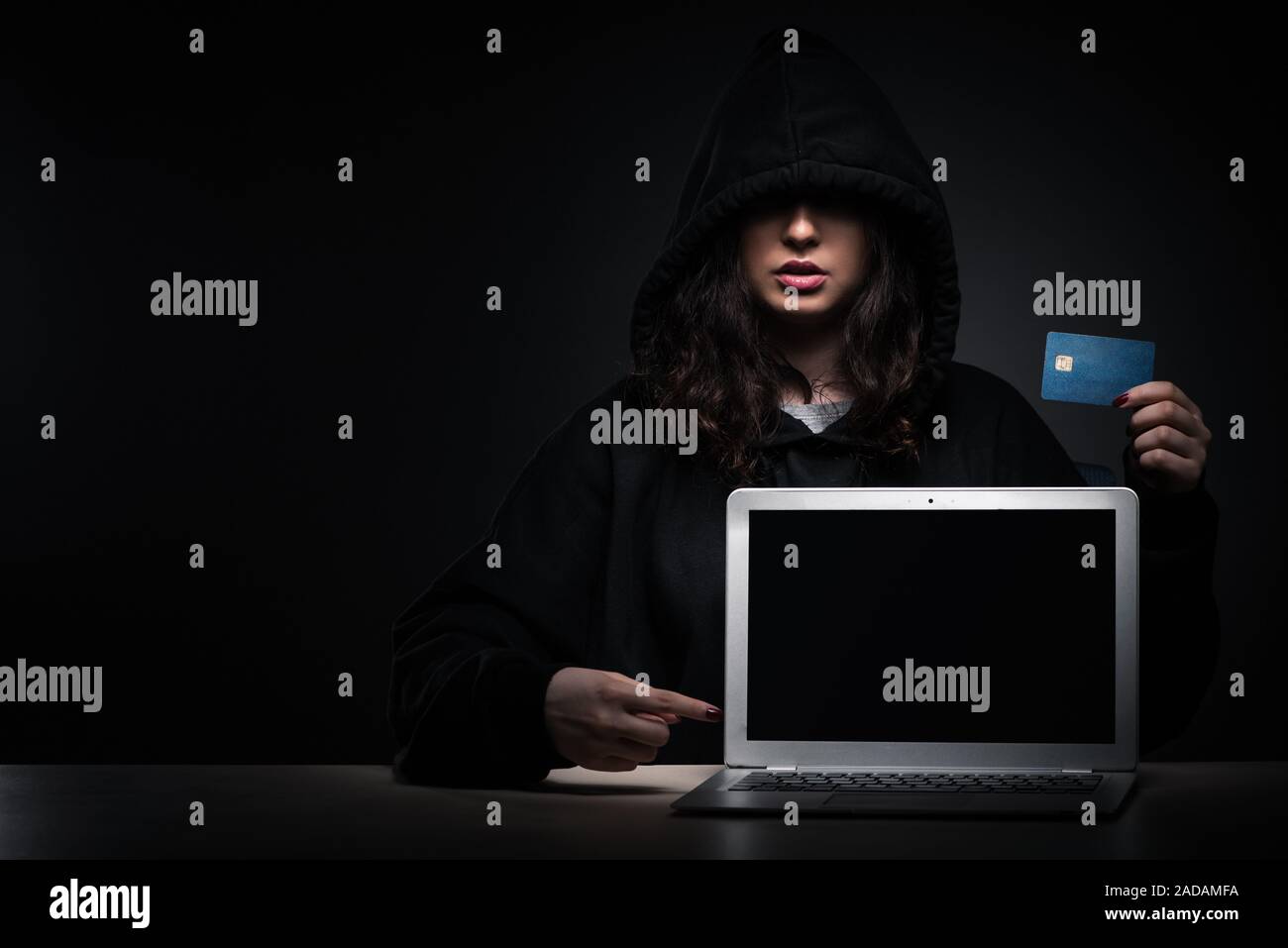 Female hacker hacking security firewall late in office Stock Photo - Alamy