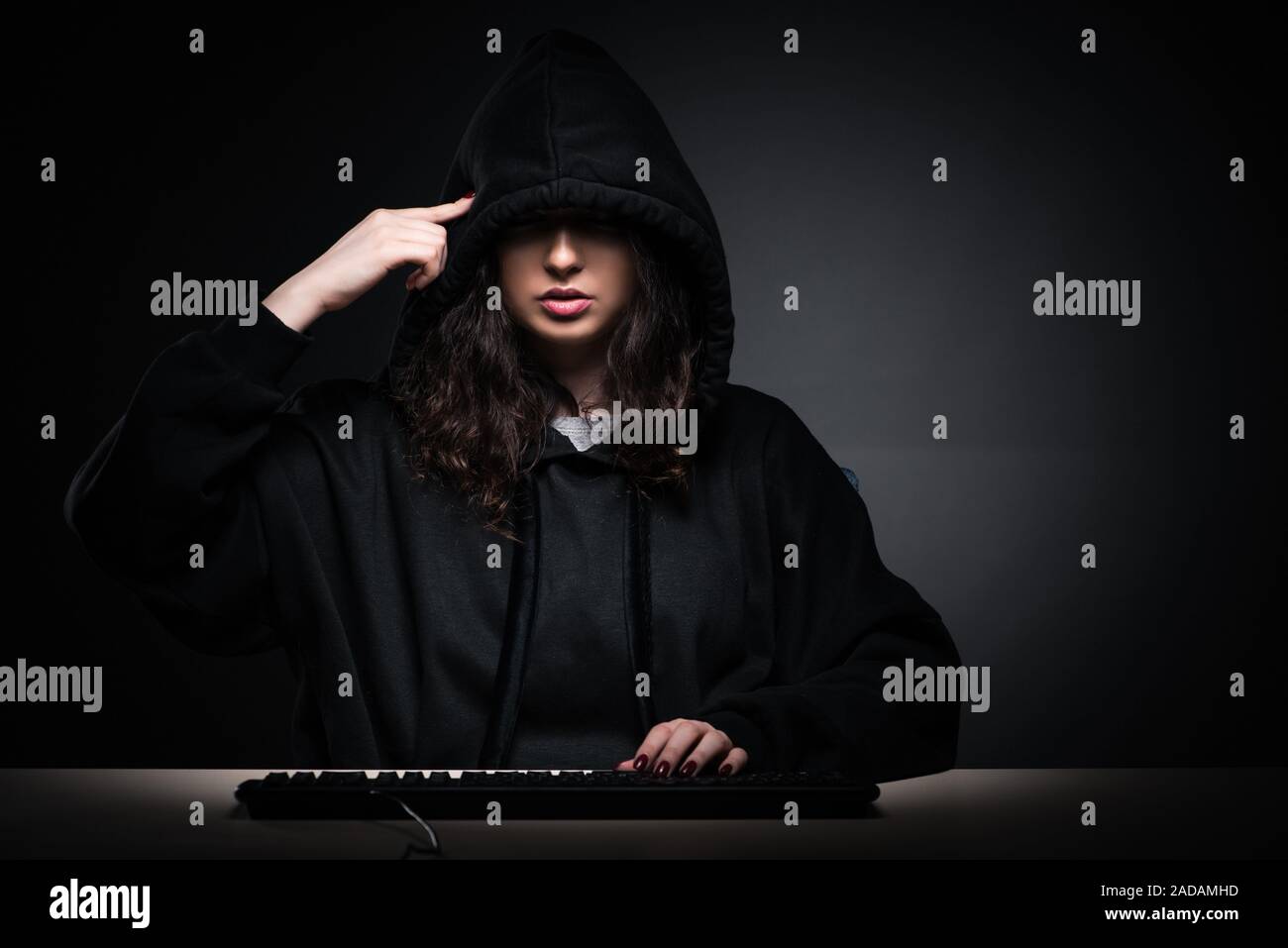 Female hacker hacking security firewall late in office Stock Photo - Alamy