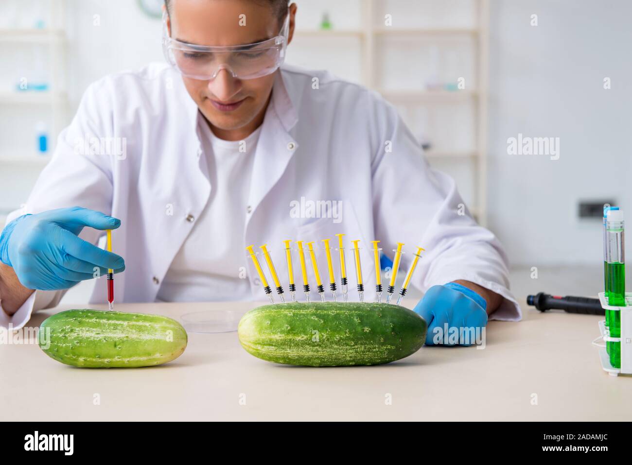 Male nutrition expert testing vegetables in lab Stock Photo - Alamy