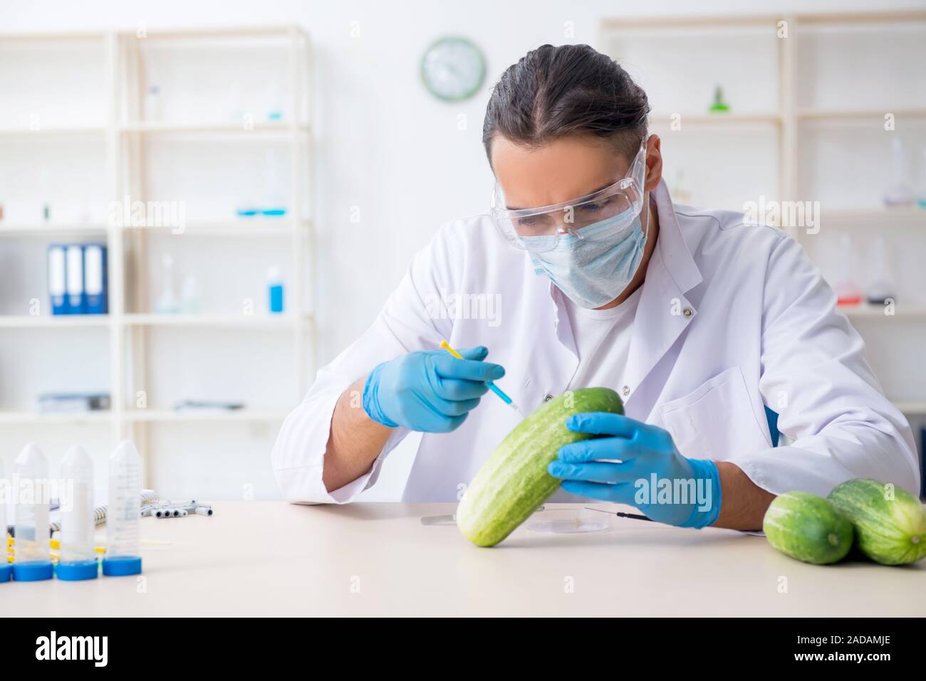 Male nutrition expert testing vegetables in lab Stock Photo - Alamy
