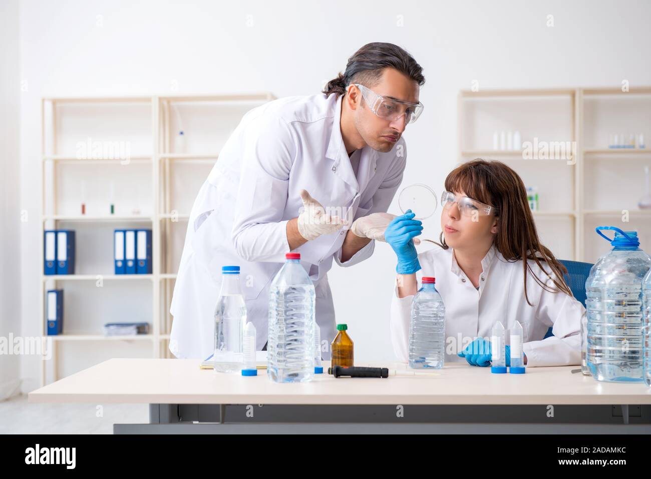 Two chemists working in the lab Stock Photo - Alamy