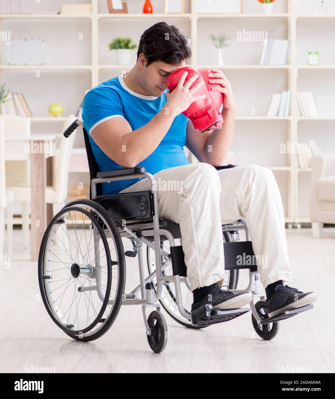Disabled boxer at wheelchair recovering from injury Stock Photo - Alamy