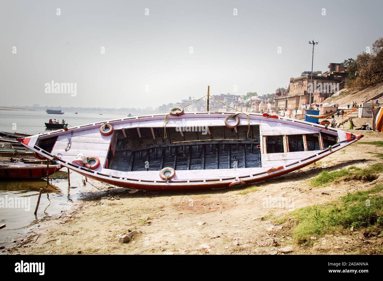 boat repair (boat inverted for drying, caulking and painting Stock ...