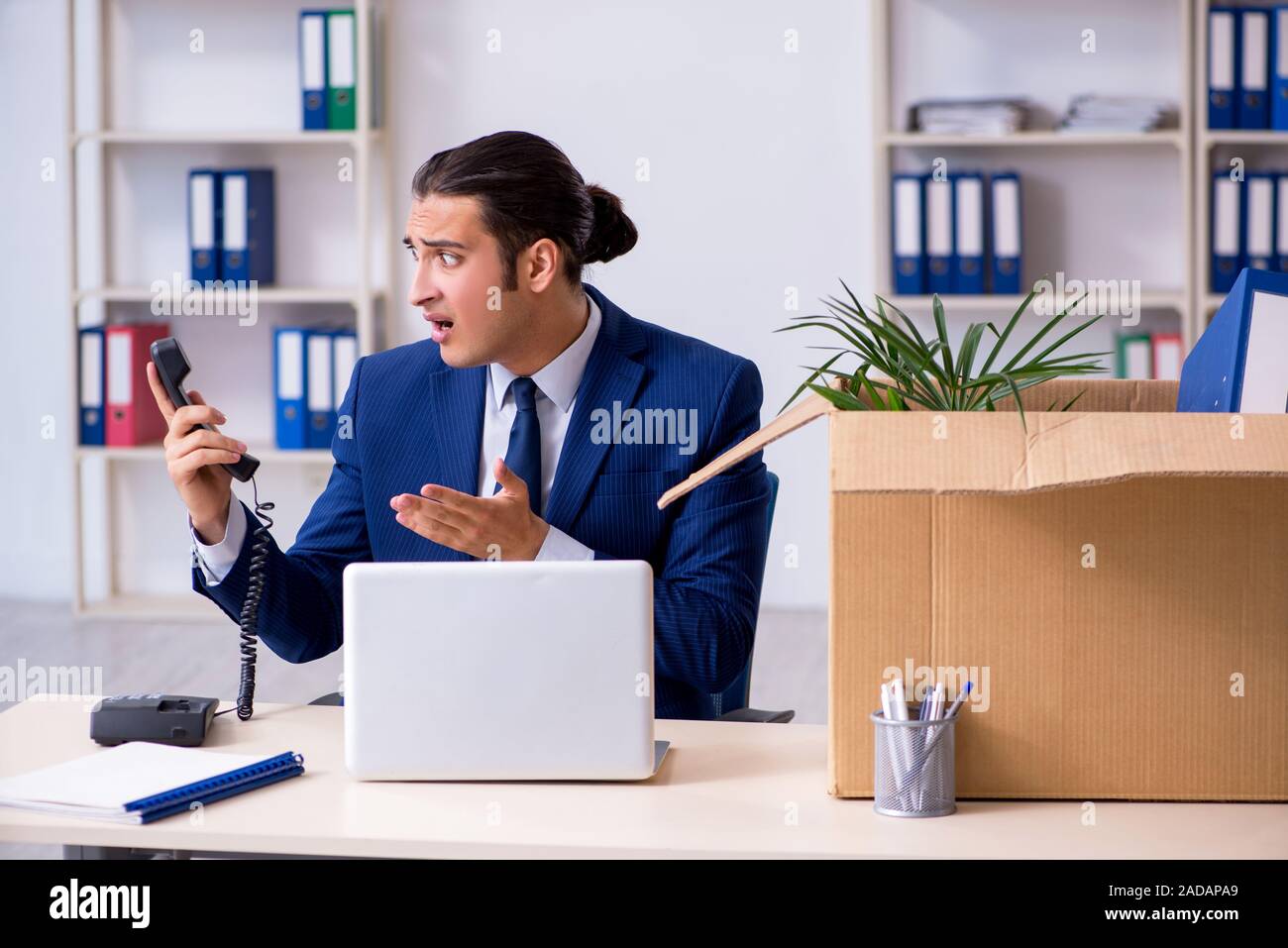 Young employee being made redundant Stock Photo - Alamy