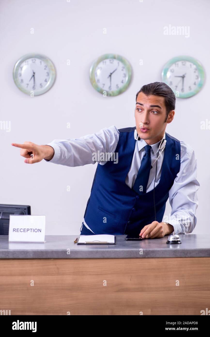 Receptionist speaking guest hi-res stock photography and images - Alamy