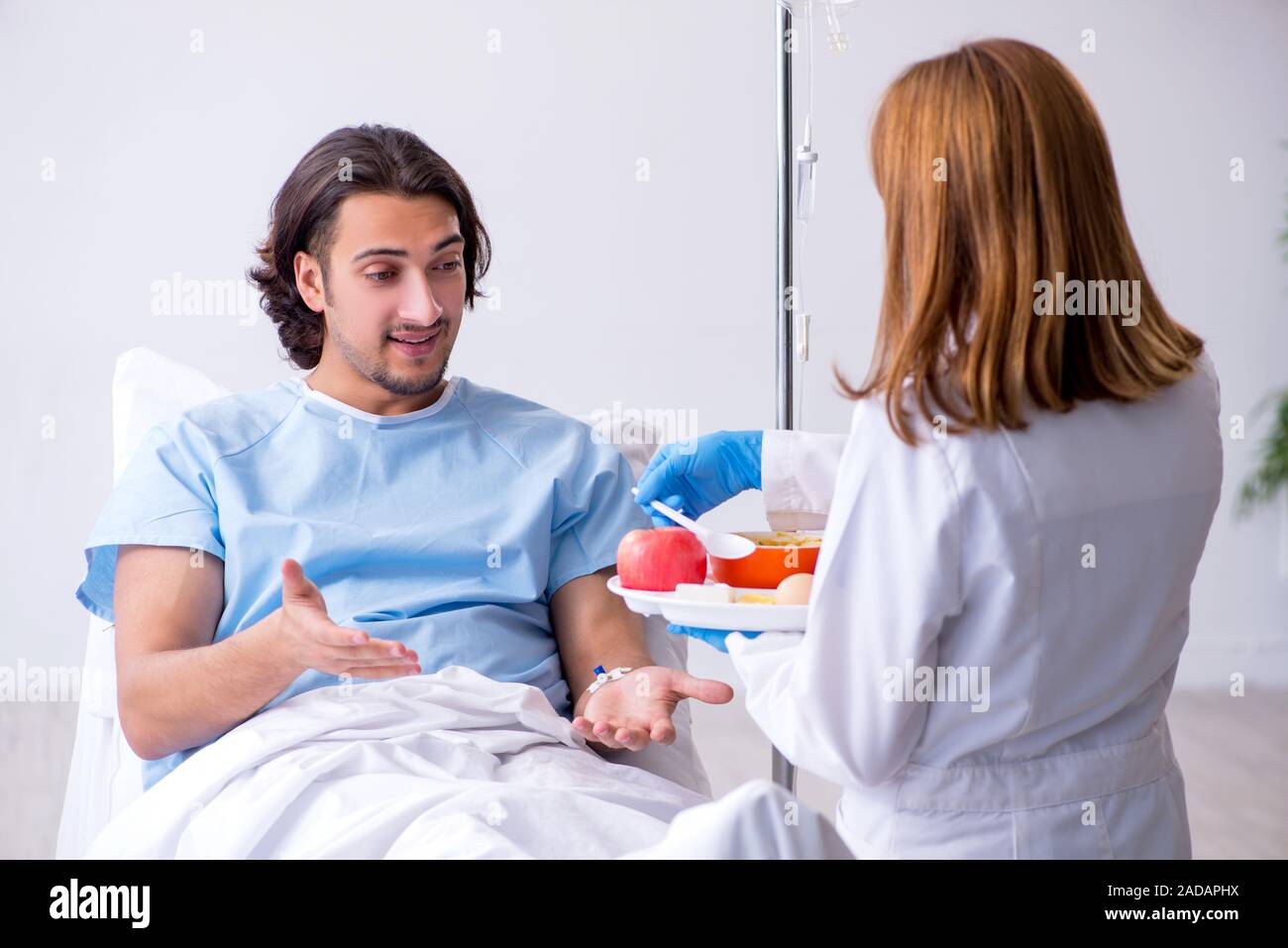 Male patient eating food in the hospital Stock Photo - Alamy