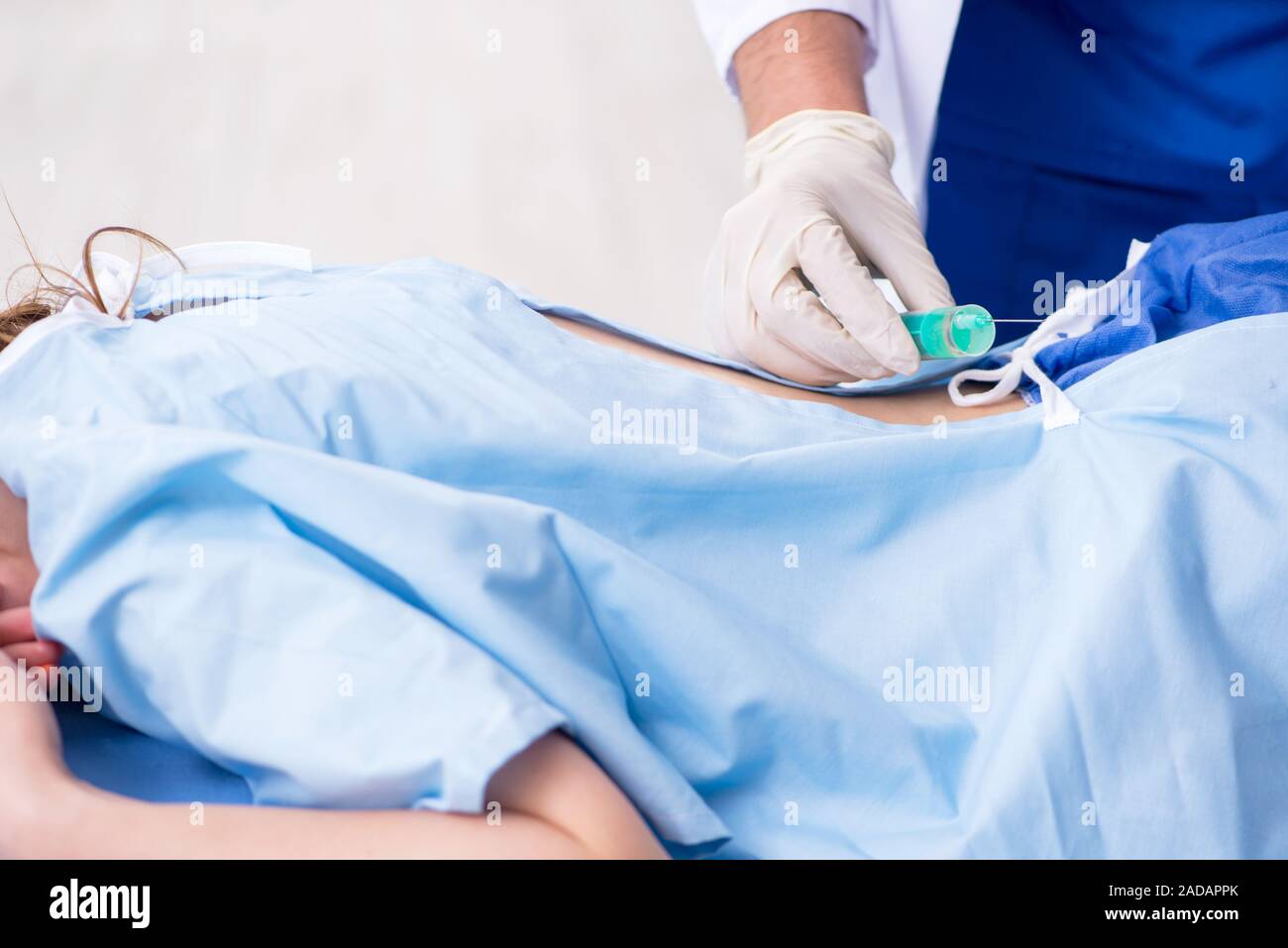 Female patient getting an injection in the clinic Stock Photo - Alamy
