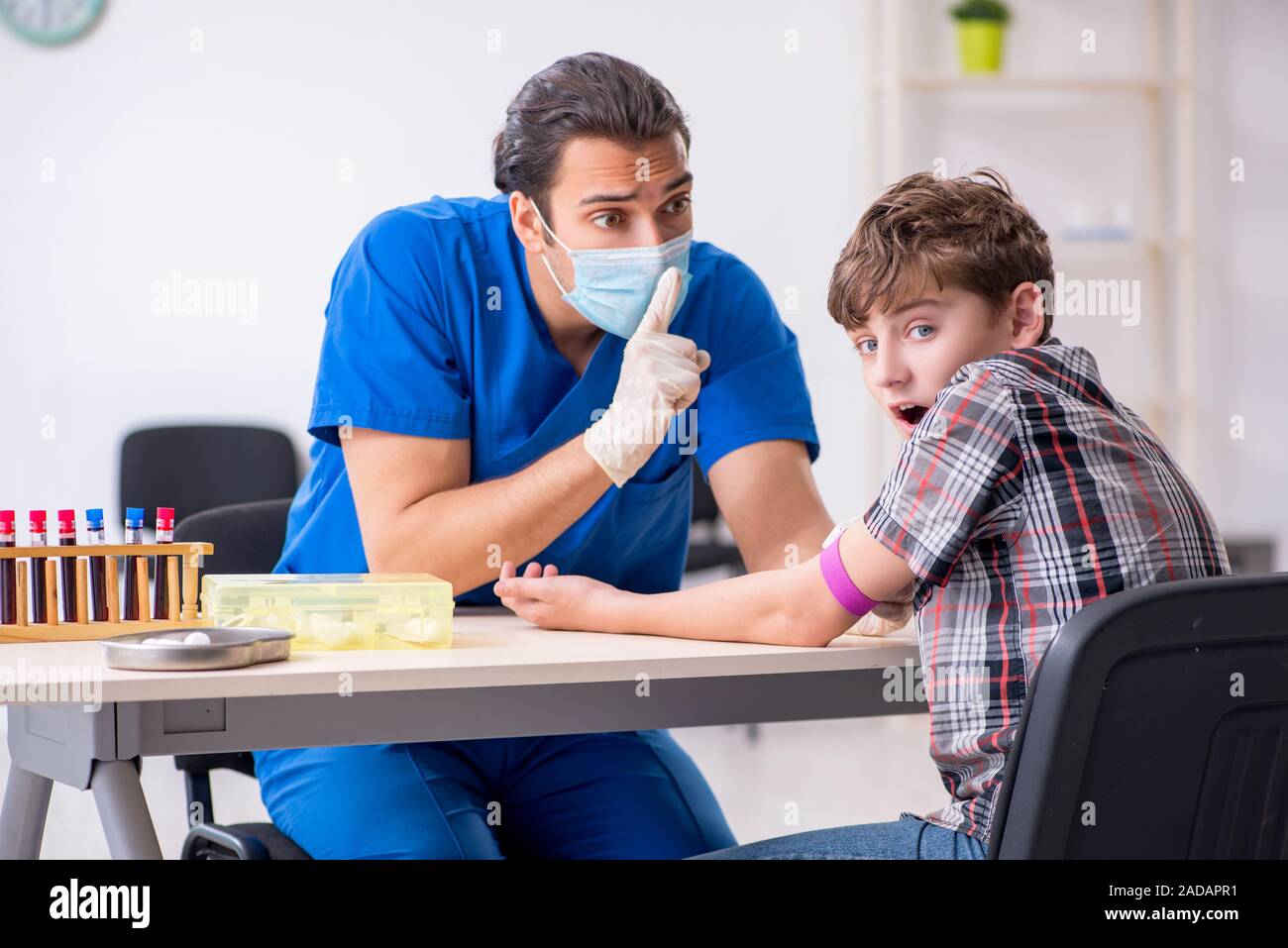Young boy visiting doctor in hospital Stock Photo - Alamy