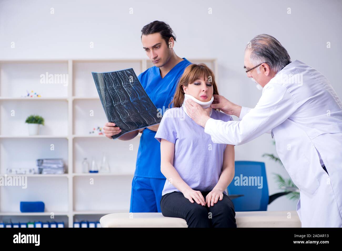 Two young doctors looking at an xray hi-res stock photography and ...