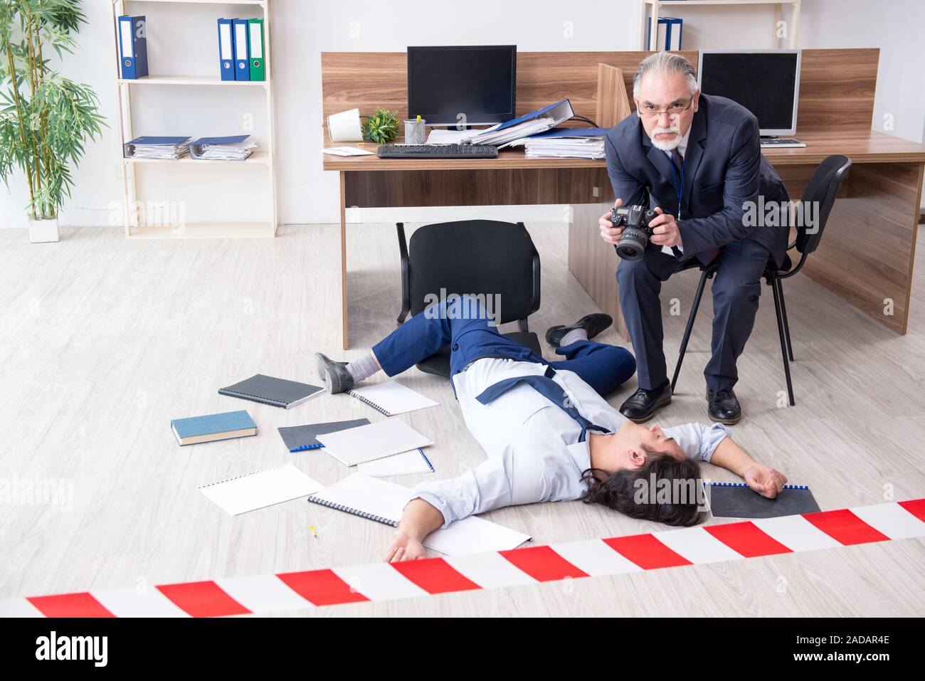 Forensic investigator and dead employee in the off hi-res stock ...