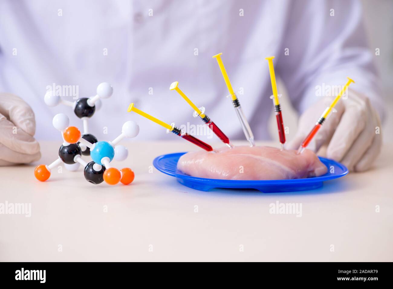 Male nutrition expert testing food products in lab Stock Photo - Alamy