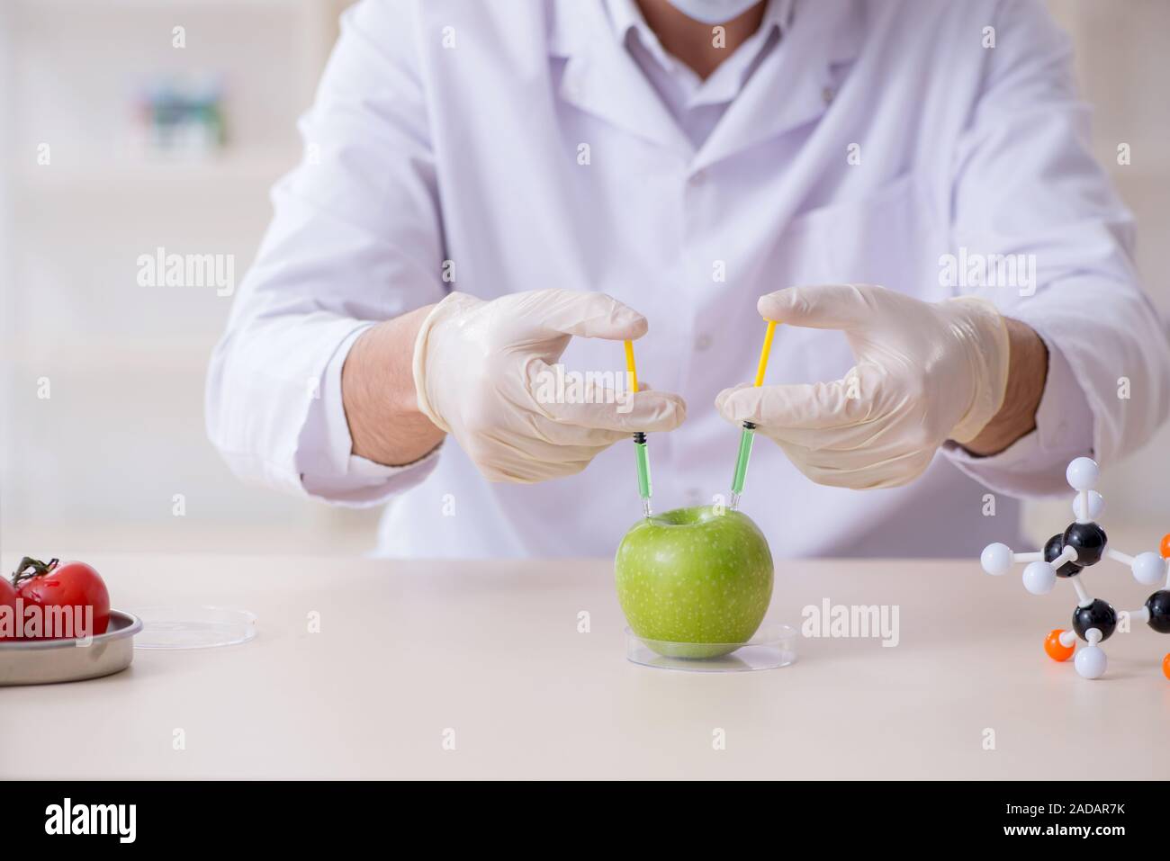 Male nutrition expert testing food products in lab Stock Photo - Alamy