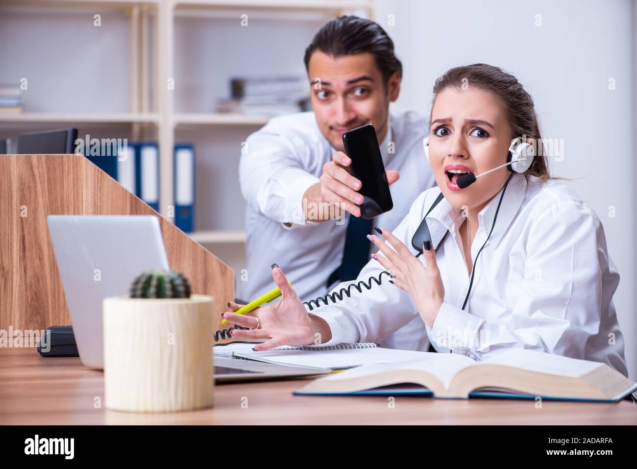 Call center operators working in the office Stock Photo - Alamy