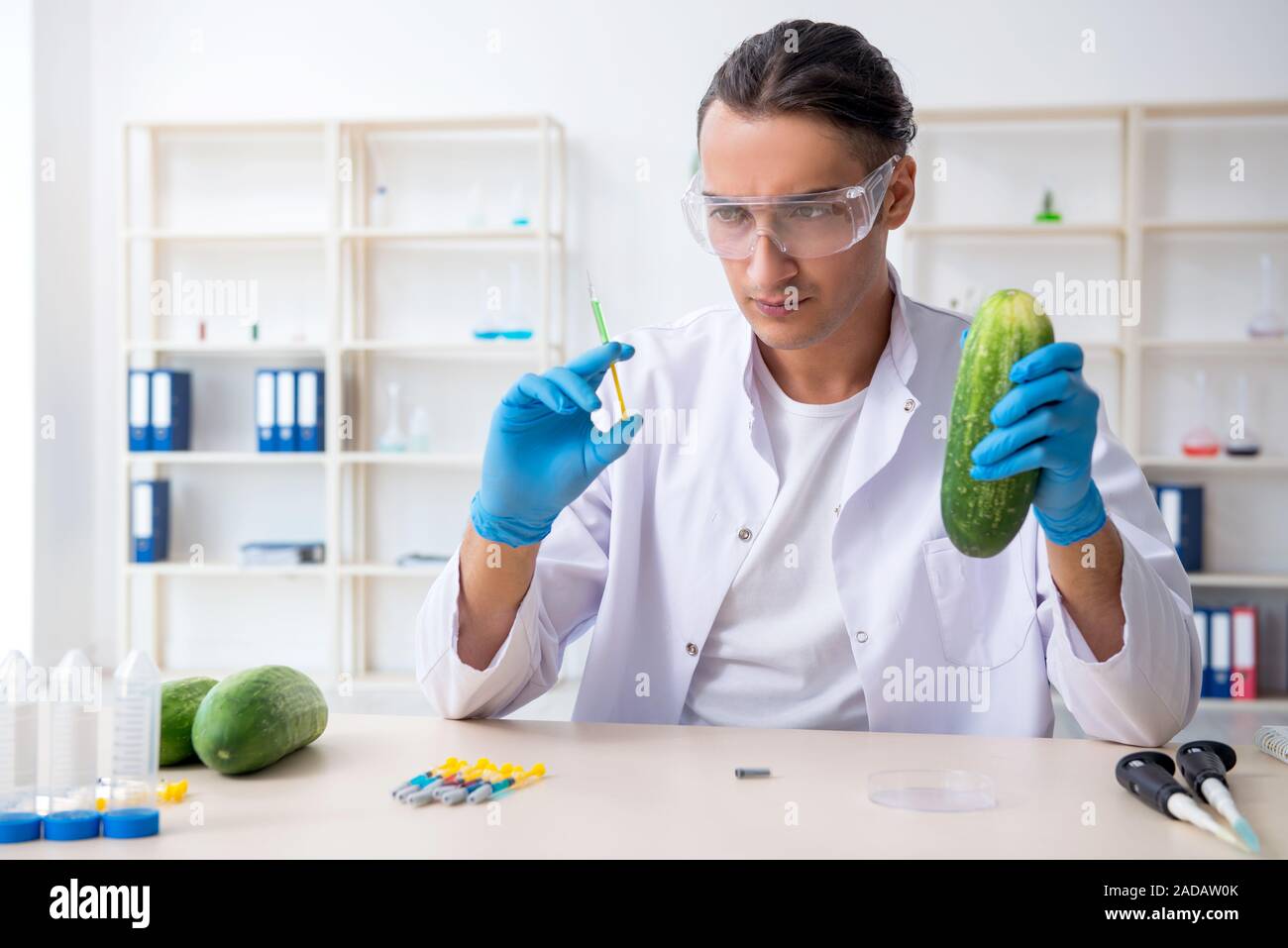 Male nutrition expert testing vegetables in lab Stock Photo - Alamy