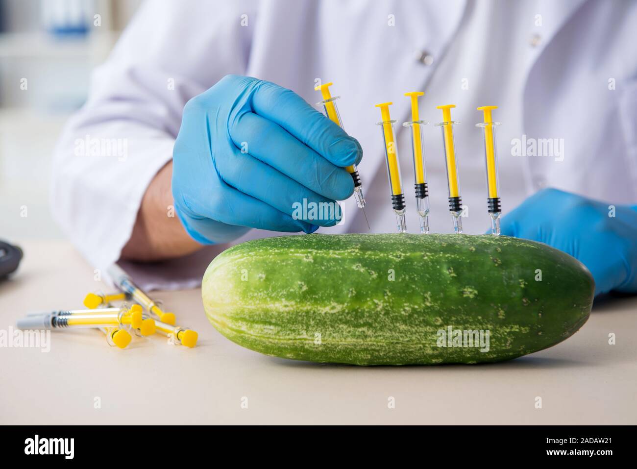 Male nutrition expert testing vegetables in lab Stock Photo - Alamy