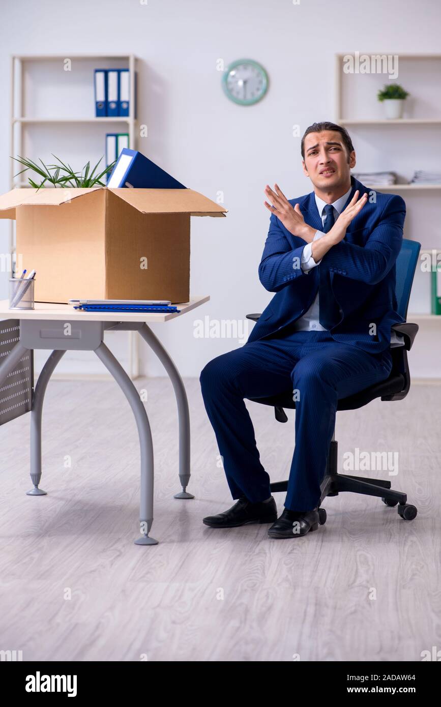Young employee being made redundant Stock Photo - Alamy