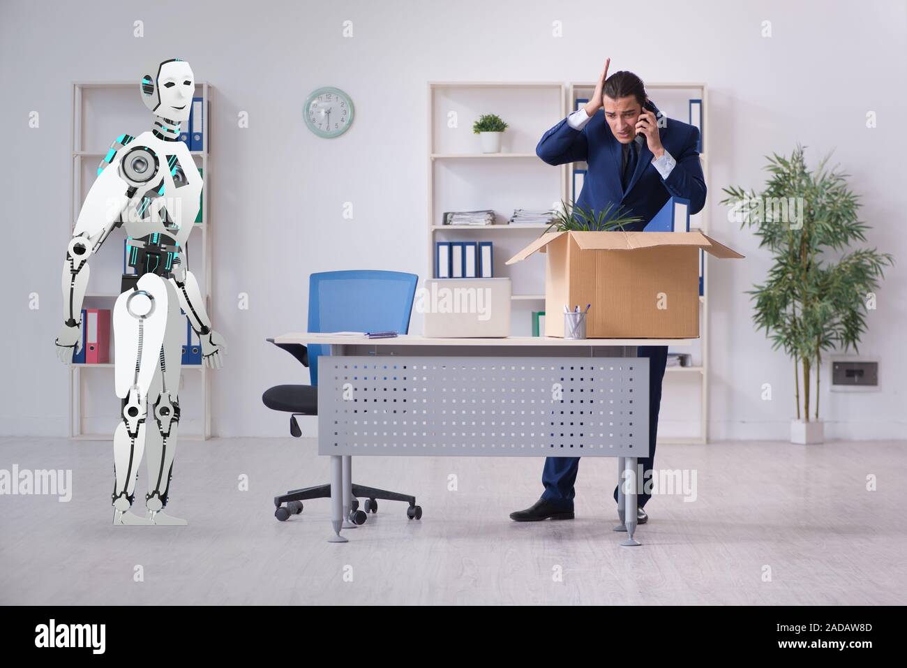 Concept of robots replacing humans in offices Stock Photo - Alamy