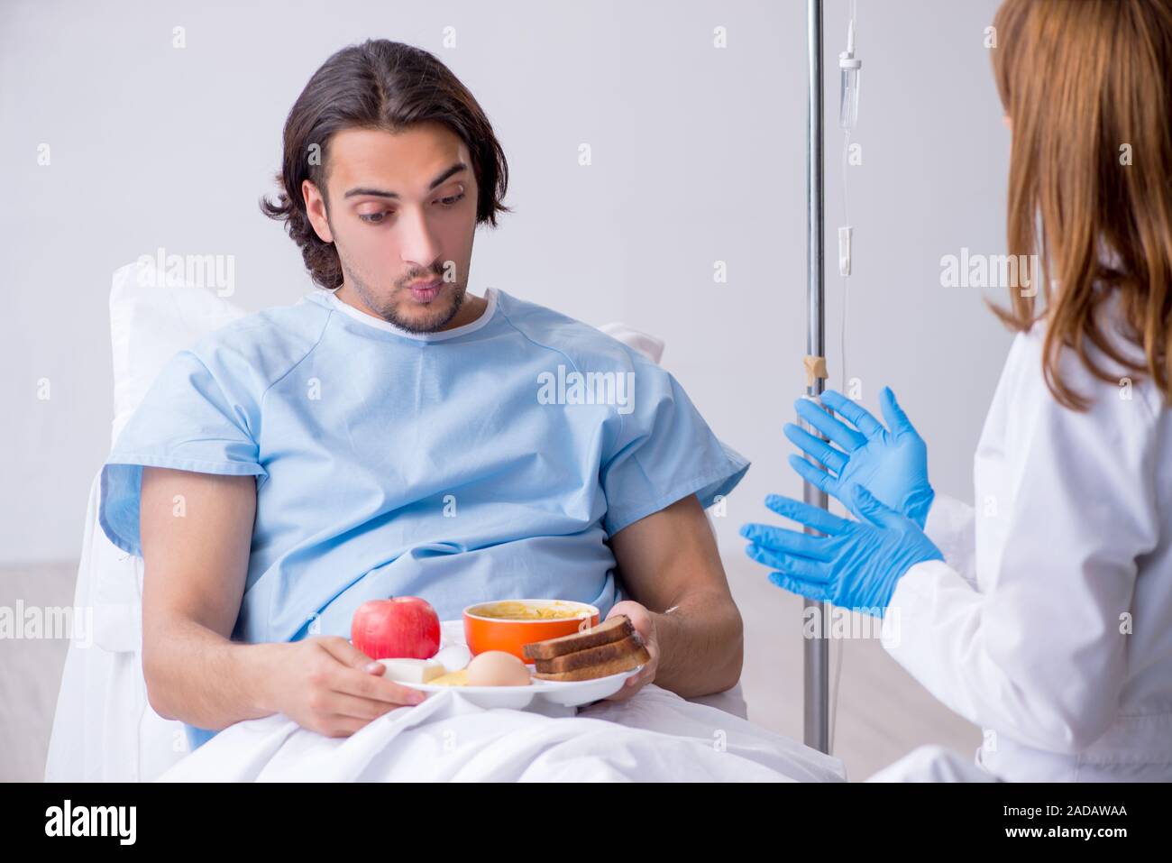 Male patient eating food in the hospital Stock Photo - Alamy