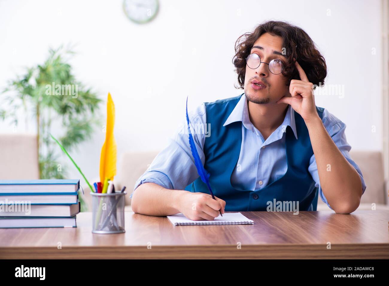 Young writer working on his new work Stock Photo - Alamy