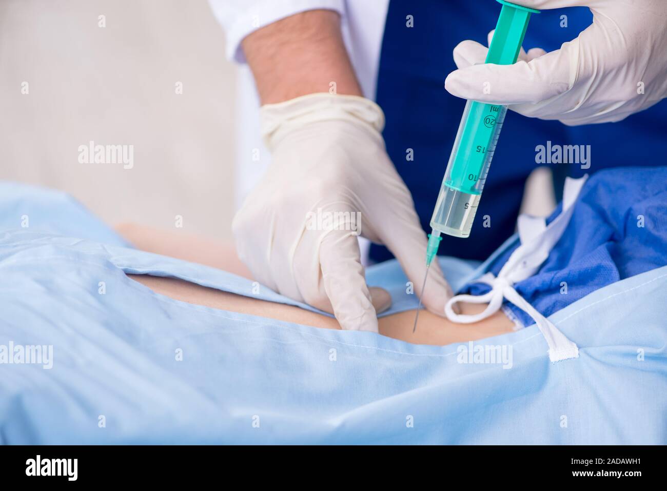 Female patient getting an injection in the clinic Stock Photo - Alamy