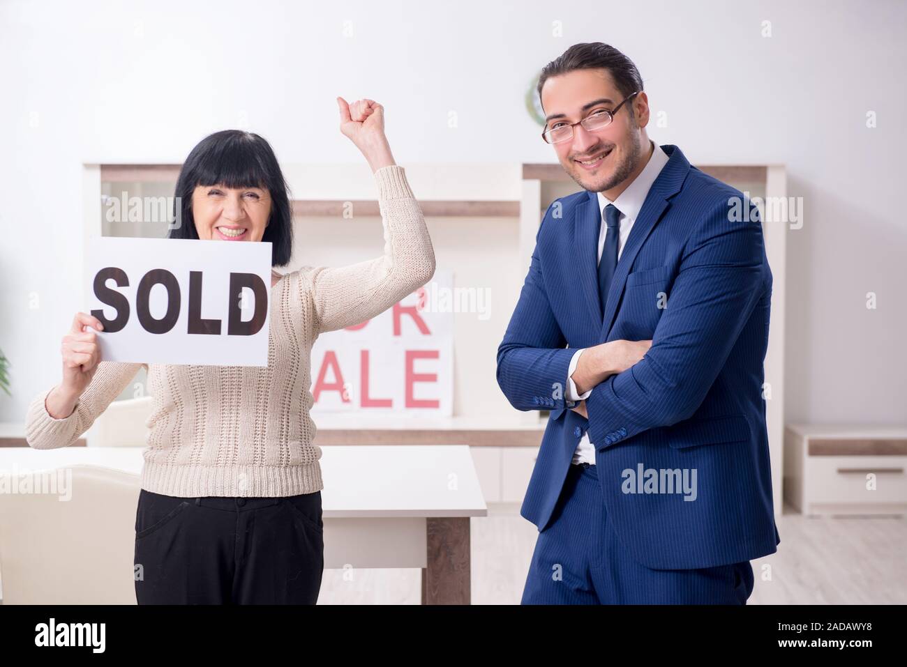 Male real estate agent and female client in the ap hi-res stock ...