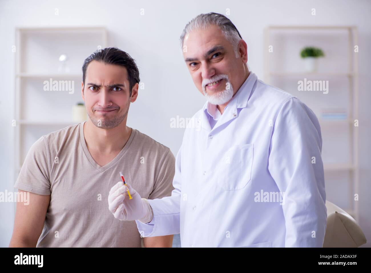 Male patient visitng doctor hi-res stock photography and images - Alamy