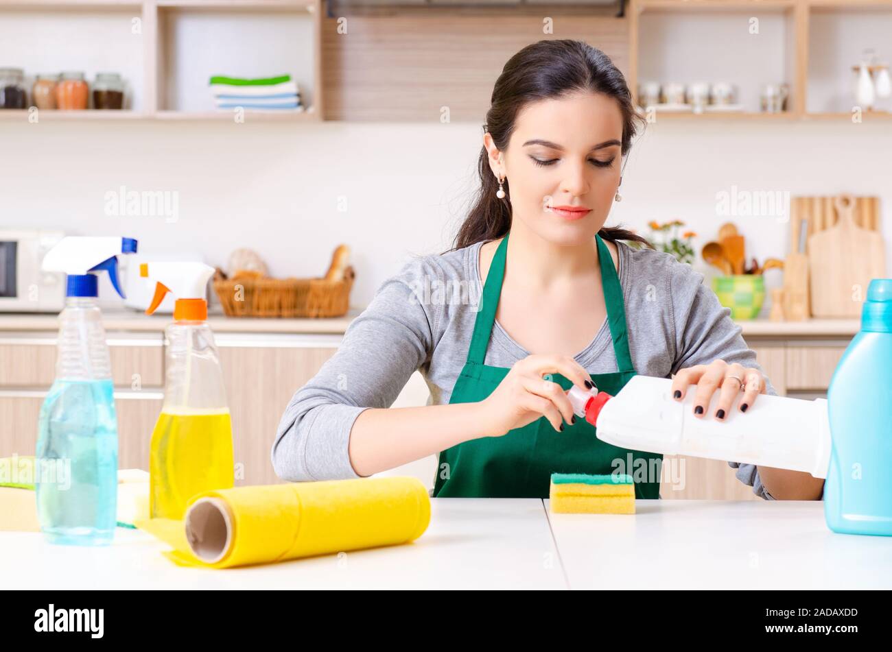 Young female contractor doing housework hi-res stock photography and ...