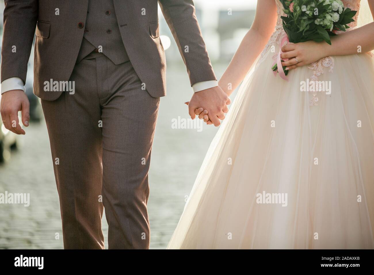 close up. bride and groom walking together. the concept of happiness ...