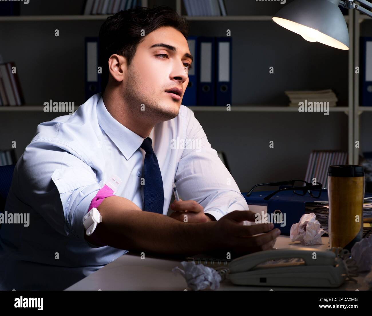 Employee relieving stress from overtime with drugs narcotics Stock ...