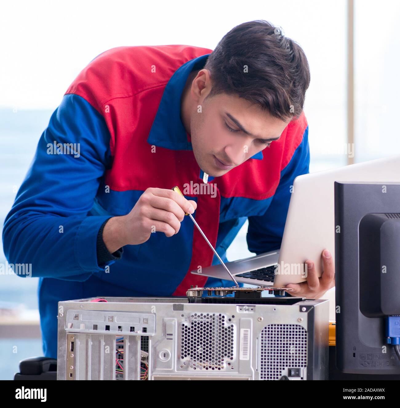 Computer repairman specialist repairing computer desktop Stock Photo ...