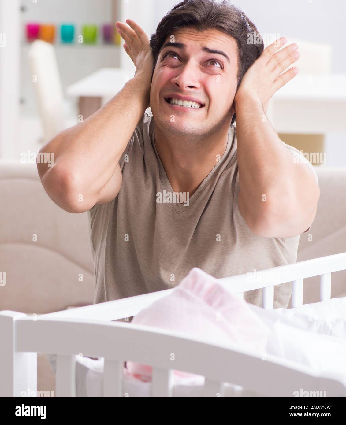 Young father dad frustrated at crying baby Stock Photo - Alamy