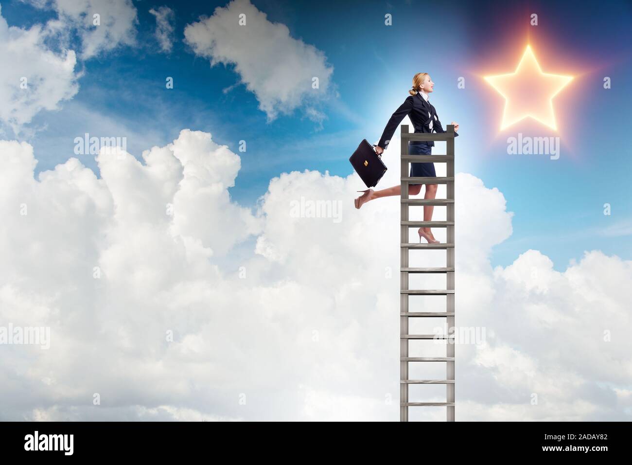 Businesswoman reaching out for stars in success concept Stock Photo - Alamy