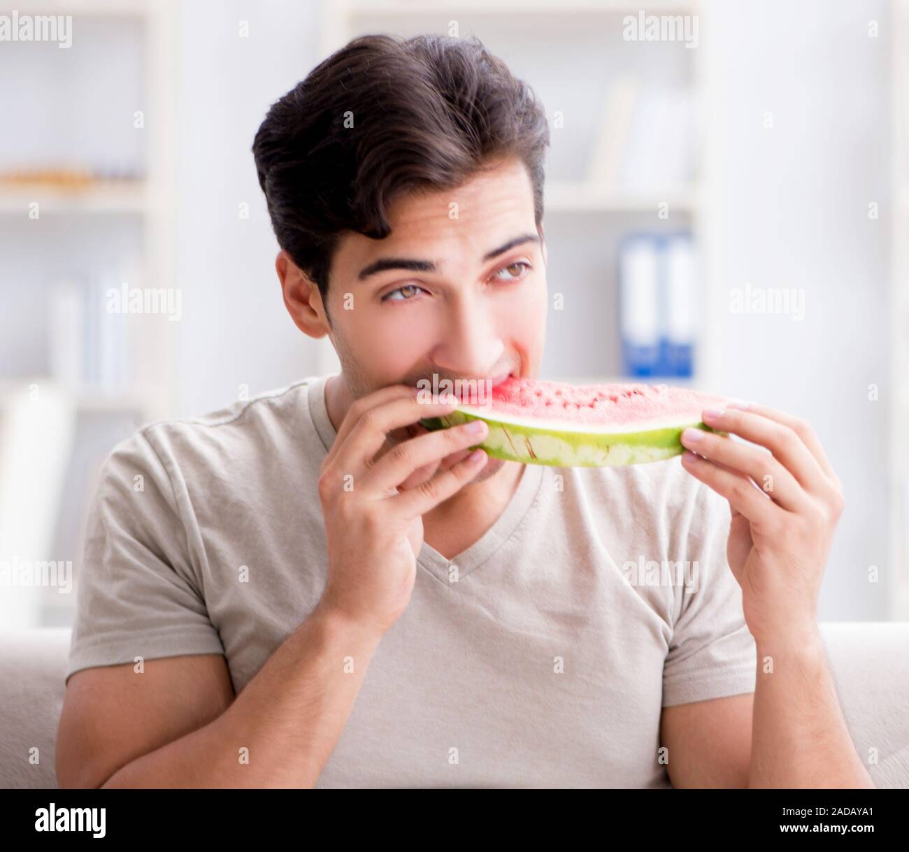 Handsome smiling boy eating tasty hi-res stock photography and images ...