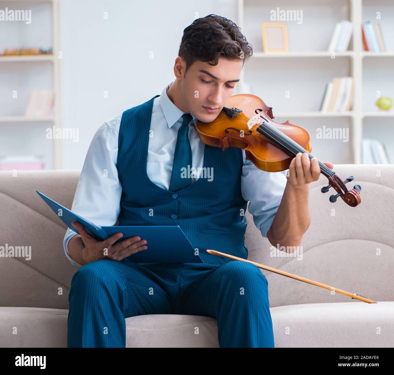 Young man practicing violin hi-res stock photography and images - Alamy
