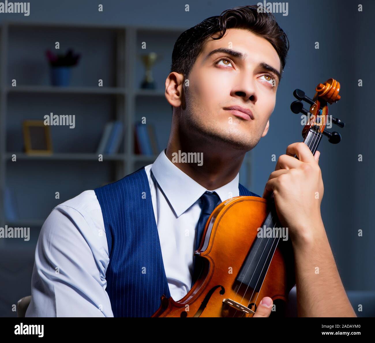 Young musician man practicing playing violin at home Stock Photo - Alamy