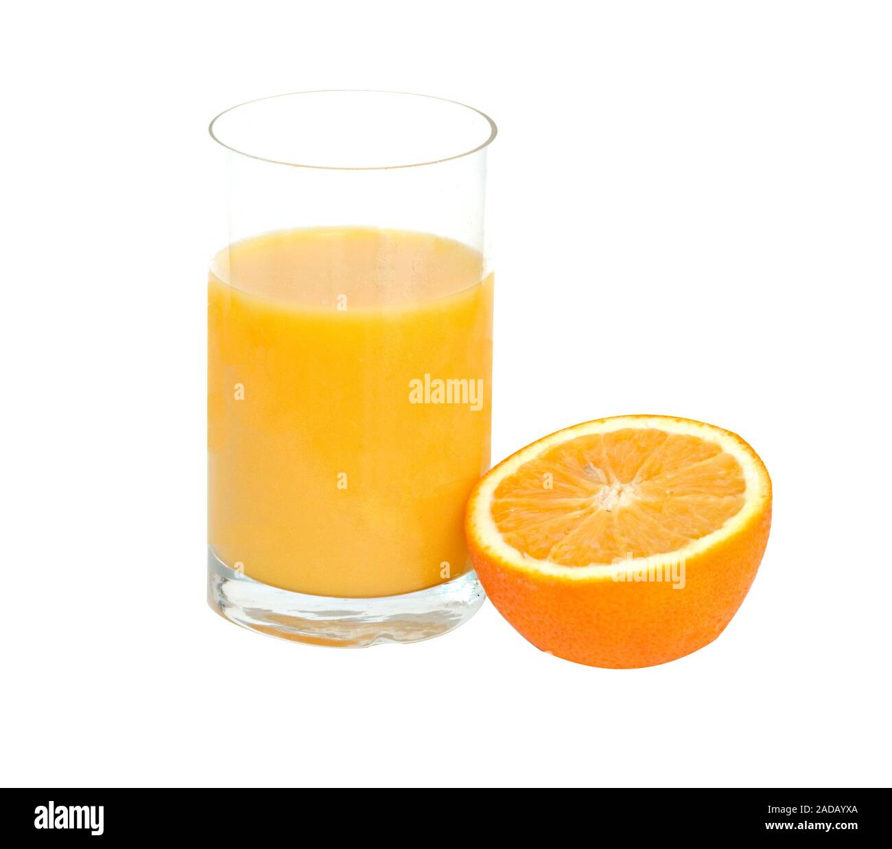 Glass of natural orange juce and section of orange Stock Photo - Alamy
