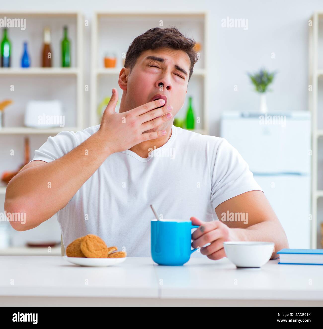Man falling asleep during his breakfast after overtime work Stock Photo ...