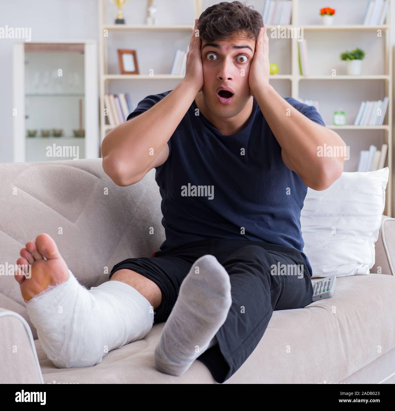 Man with broken leg recovering at home Stock Photo - Alamy