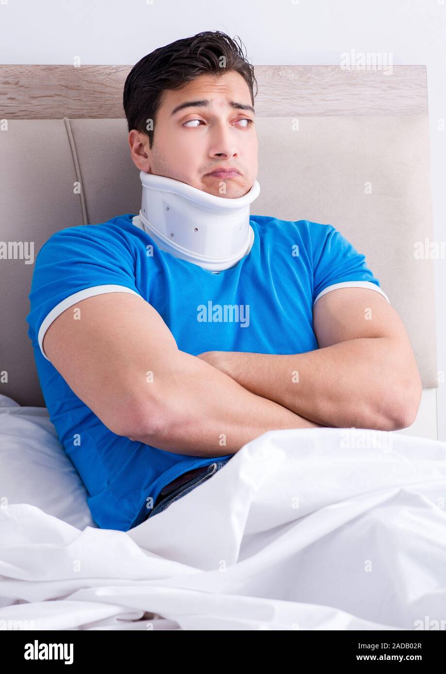 Young man with neck injury in the bed Stock Photo - Alamy