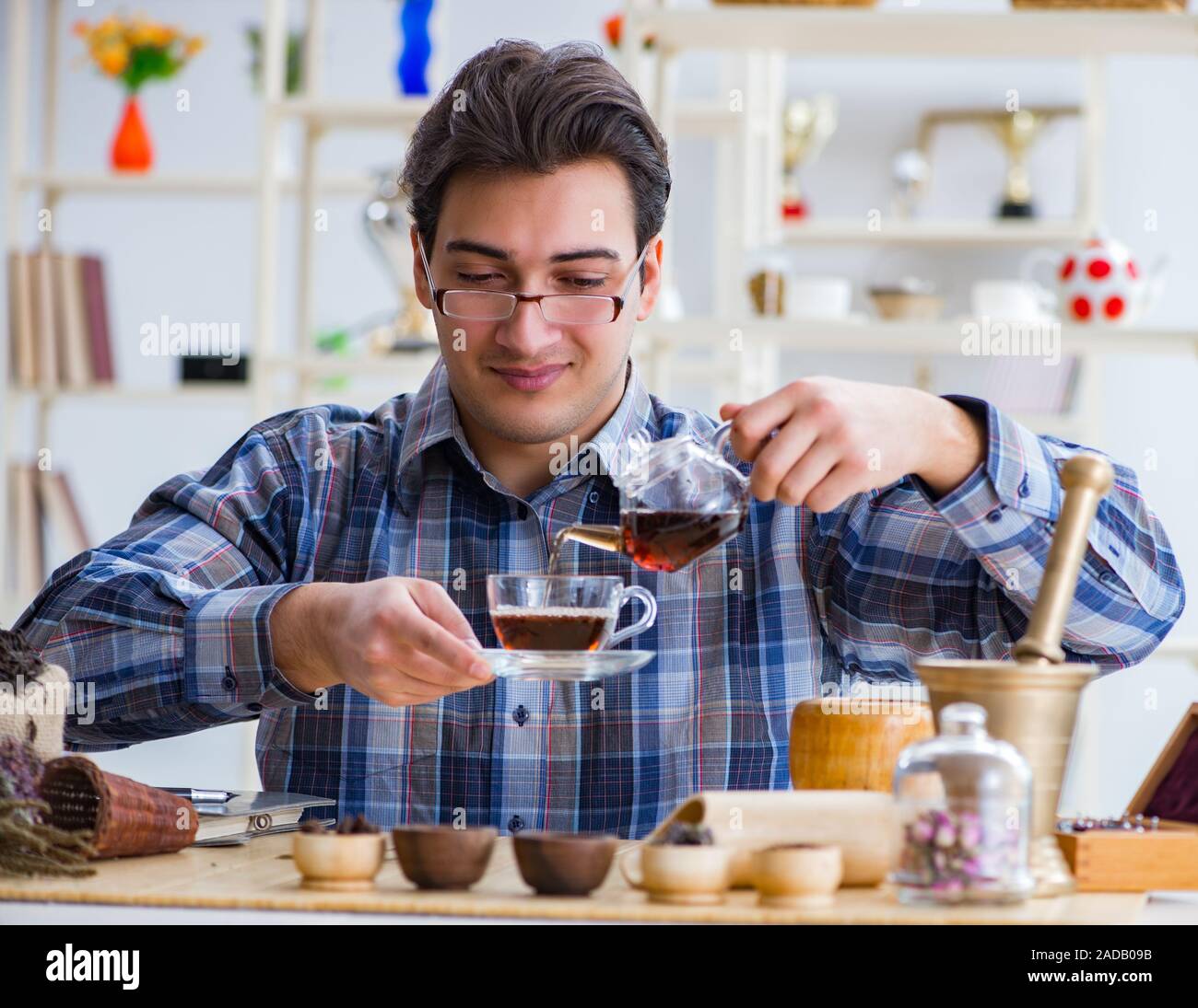 Tea expert brewing cup of drink hi-res stock photography and images - Alamy