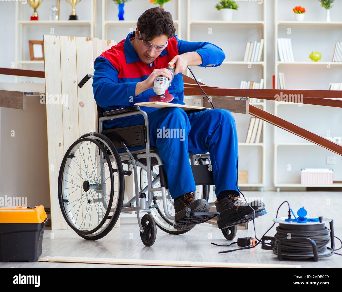 Disabled carpenter working with tools in workshop Stock Photo - Alamy