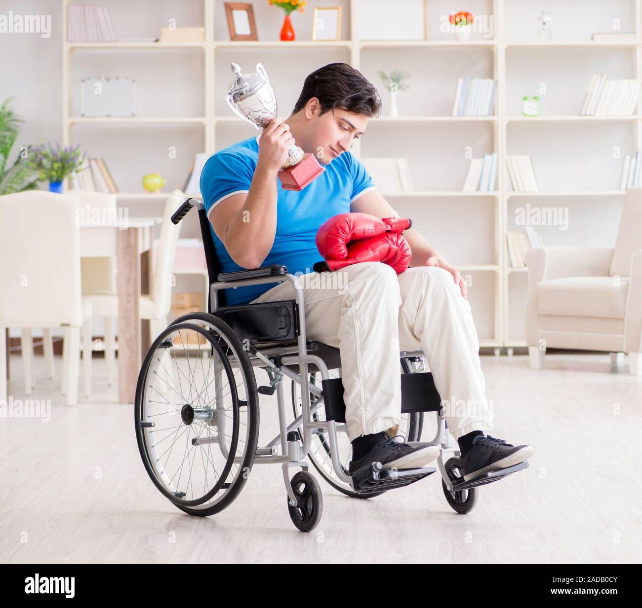 Disabled boxer at wheelchair recovering from injury Stock Photo - Alamy
